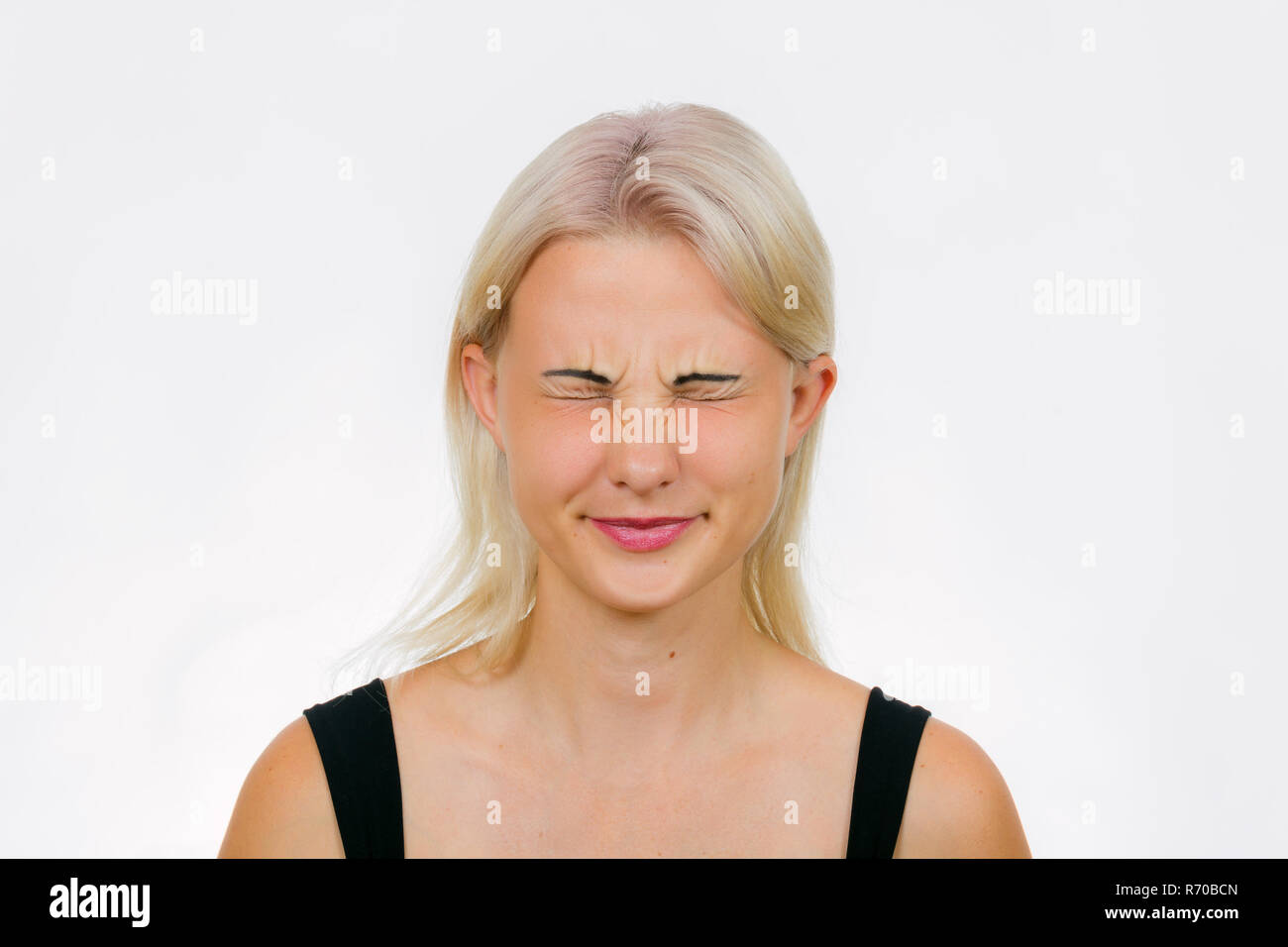 Face exercise for eyelids, woman with firmly closed eyes Stock Photo ...