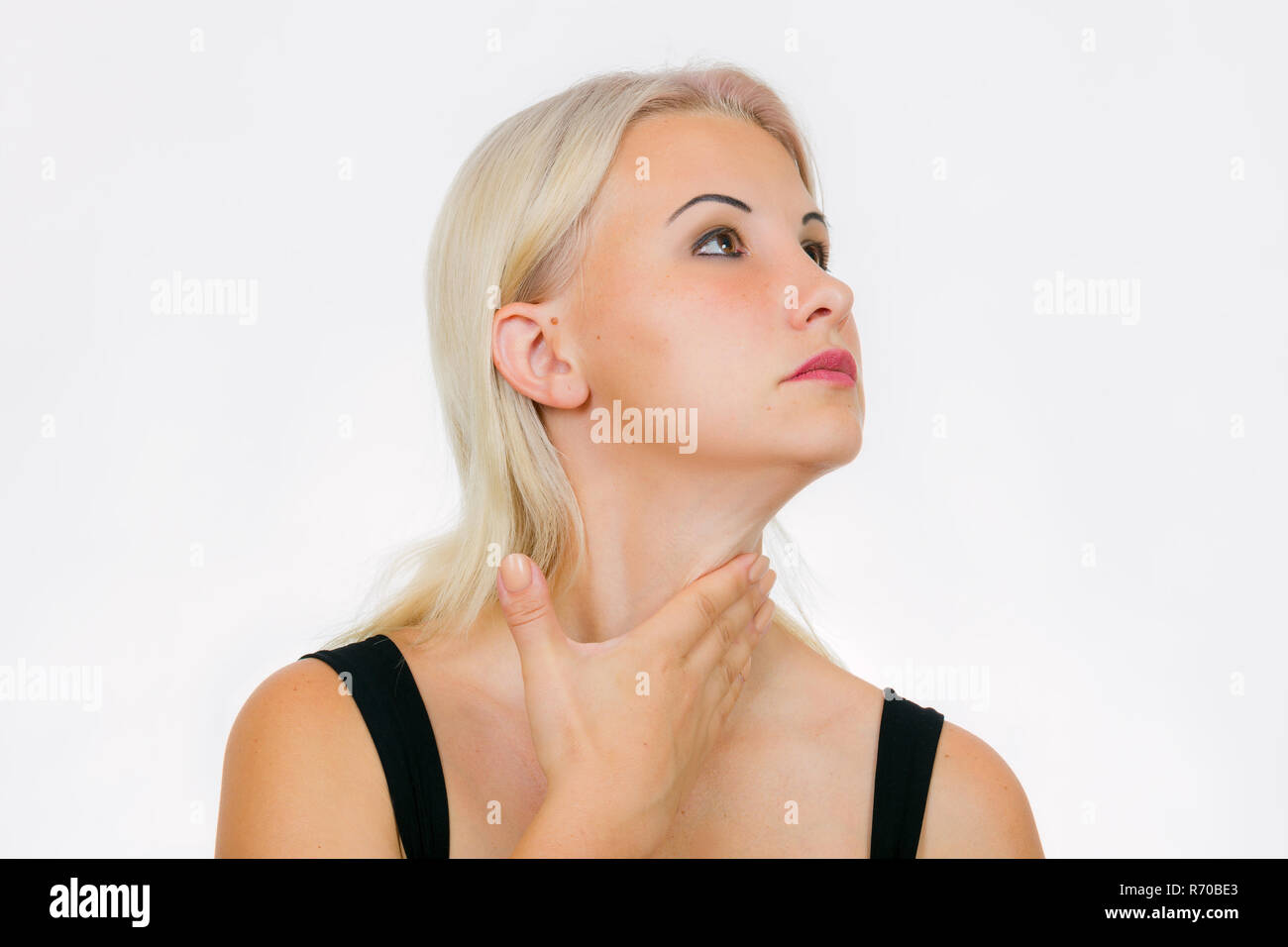 Face exercise turkey wattle massage, woman massages her neck Stock ...