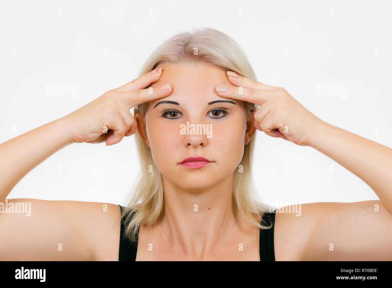 Face exercise forehead smoothing, female face with pulling the skin on ...
