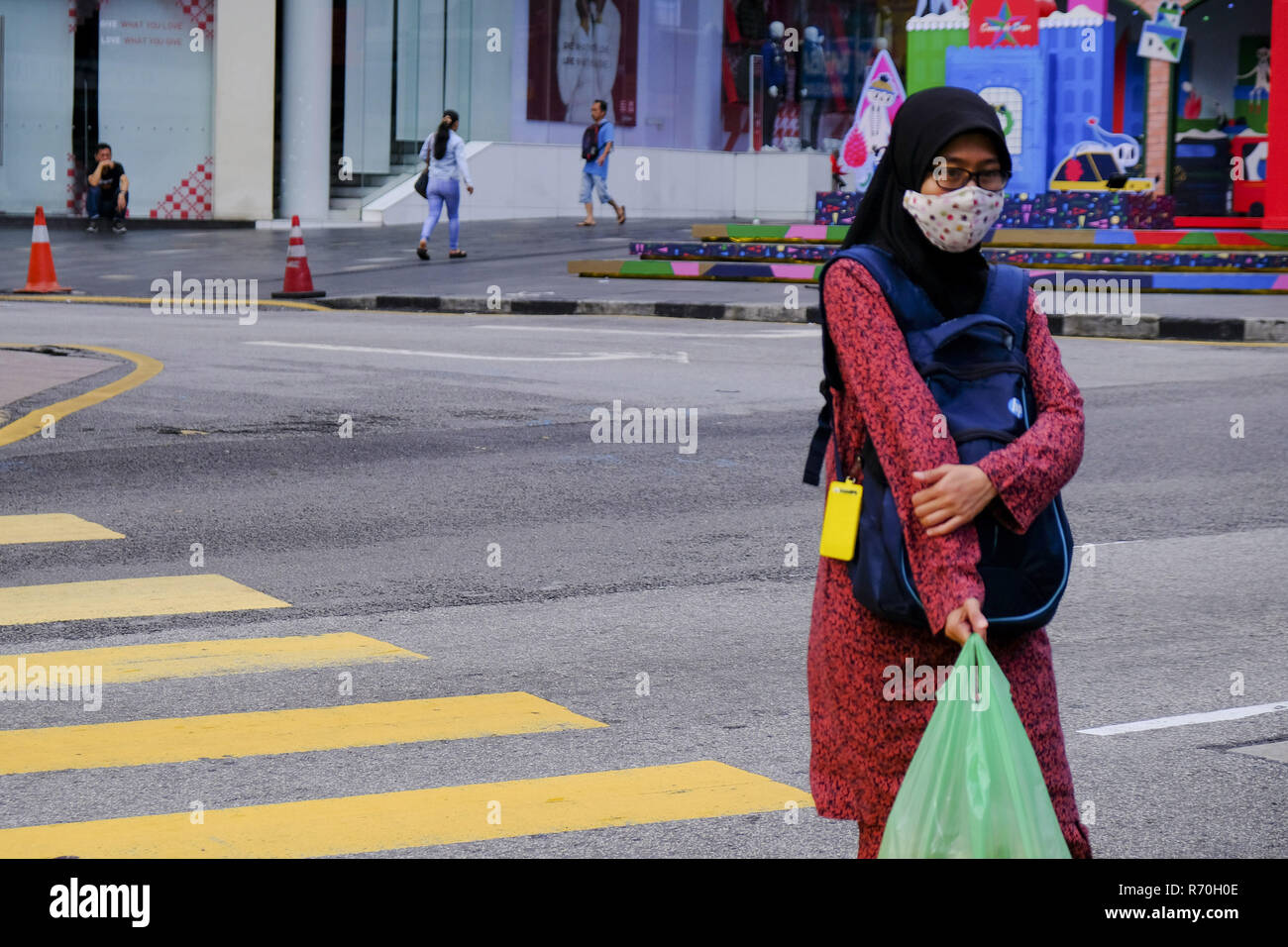 Kuala Lumpur, Kuala Lumpur, Malaysia. 5th Dec, 2018. A women with a ...