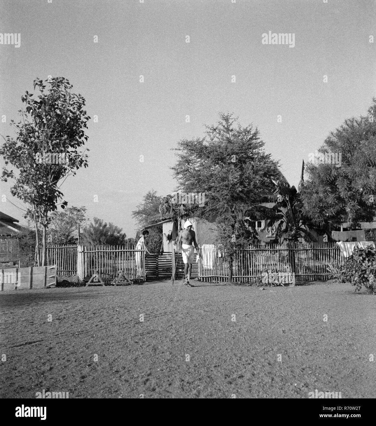 Mahatma Gandhi in front of his hut at Sevagram Ashram, Wardha ...