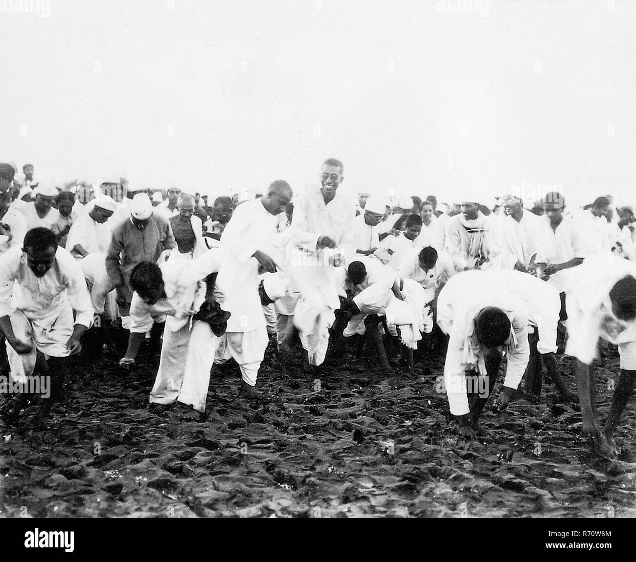 Mahatma Gandhi and others picking up natural salt at Dandi, Gujarat ...