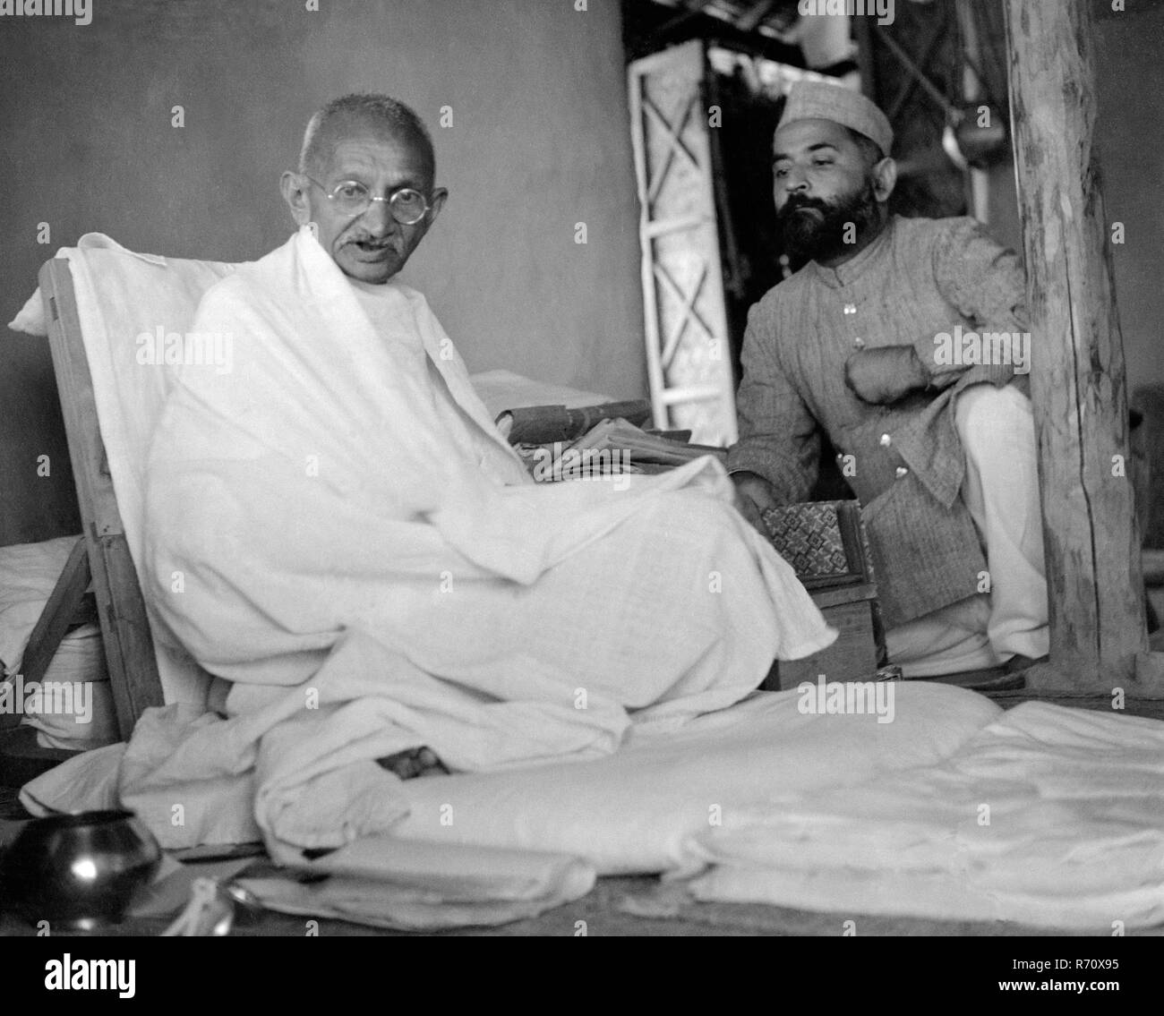 Mahatma Gandhi with Dr. Zakir Hussain in his hut at Sevagram Ashram ...