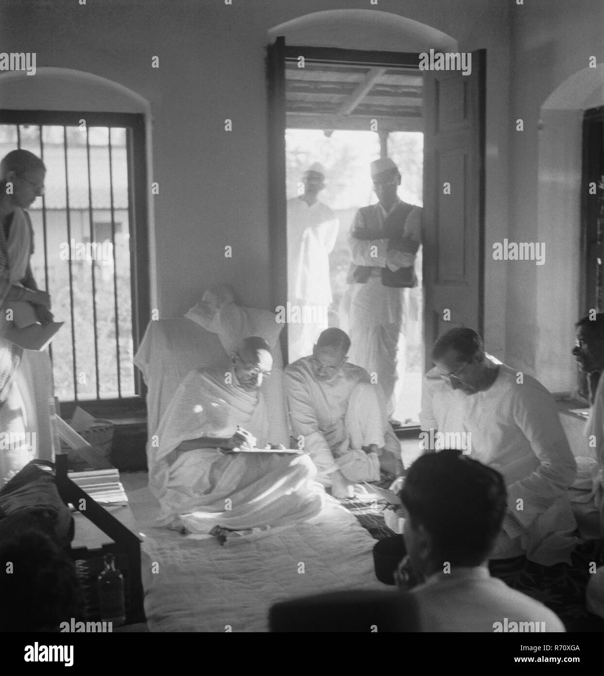 Mahatma Gandhi in a meeting with industrialist G.D. Birla (right ...