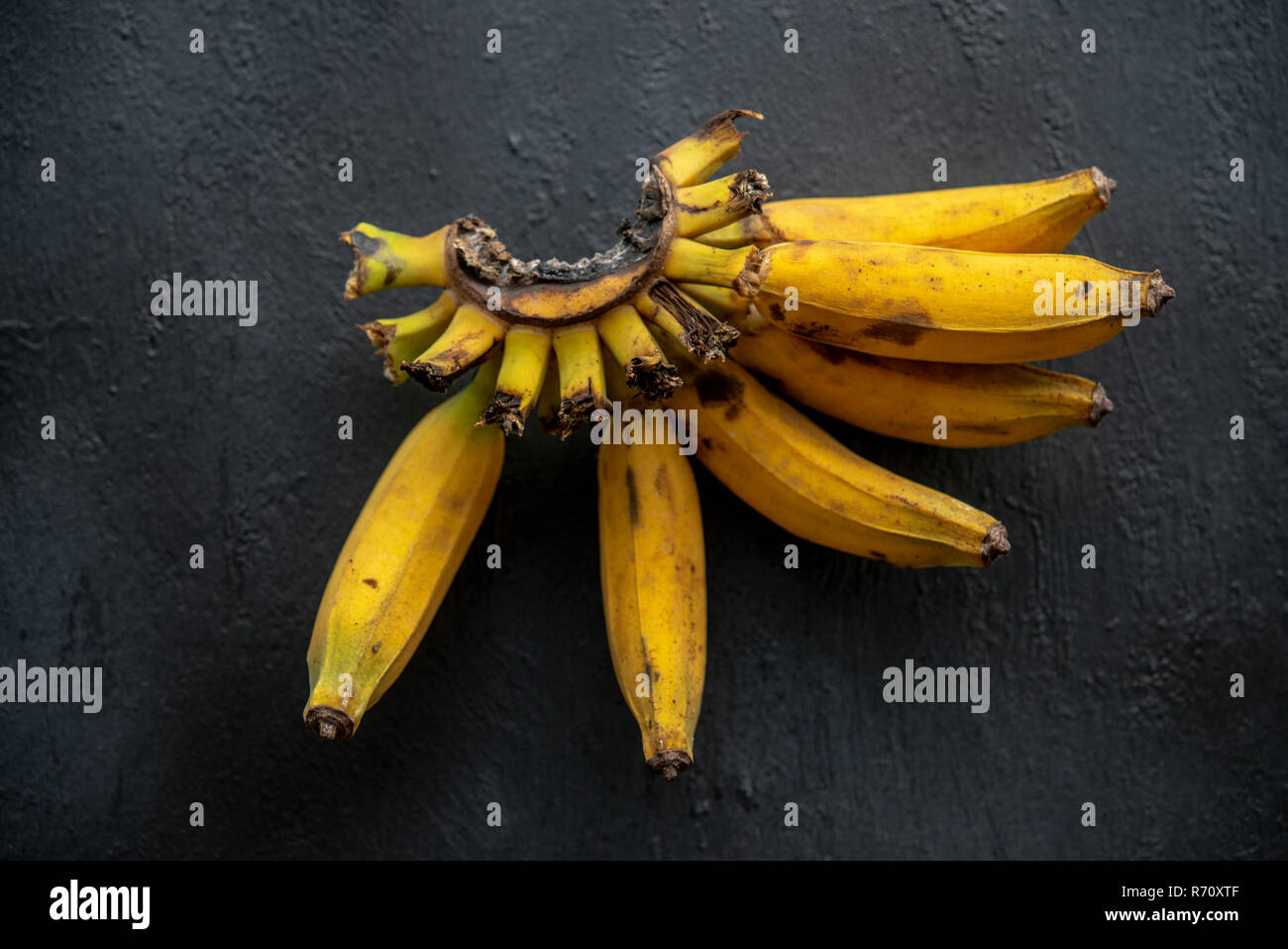 Overripe bananas on dark background Stock Photo - Alamy