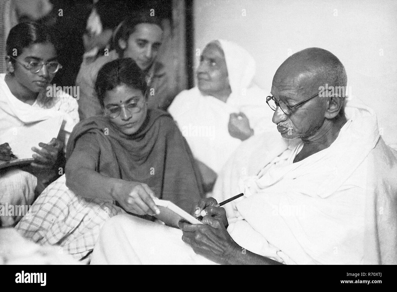 Mahatma Gandhi writing a prayer message, India, January 18, 1948, old ...