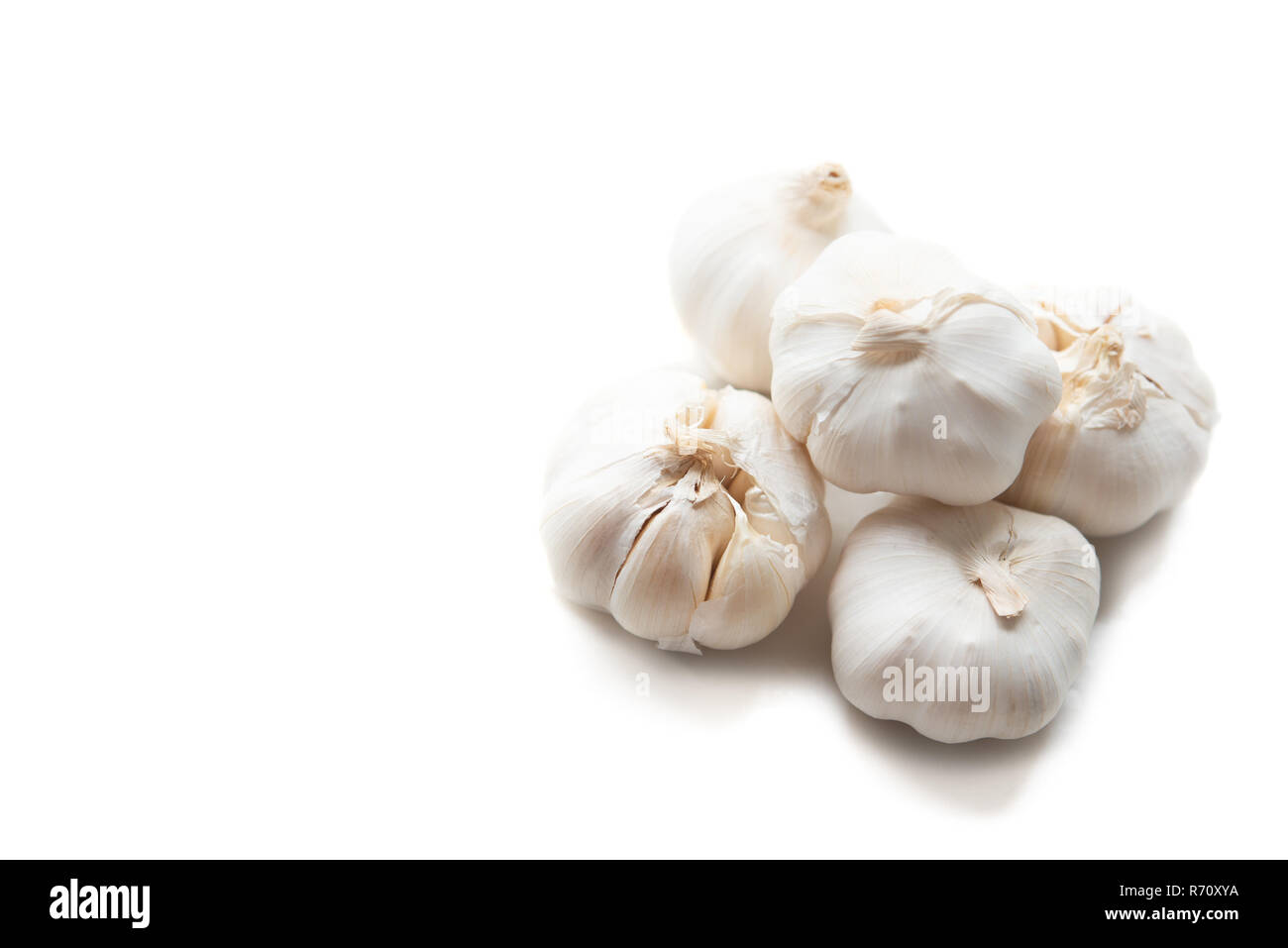 Garlic with copy space isolated on white background Stock Photo - Alamy