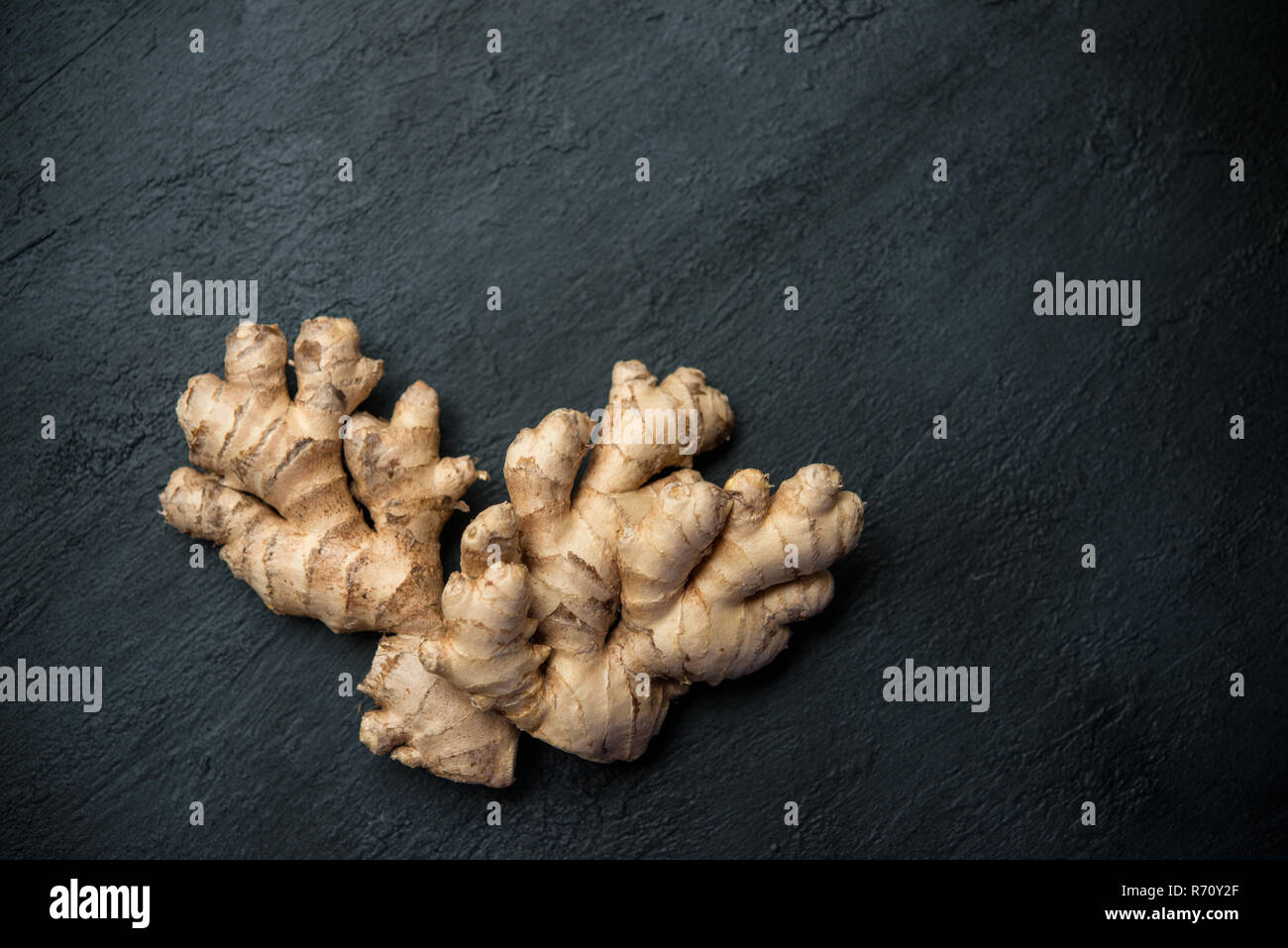 Top view fresh raw ginger root with copy space on dark background Stock ...