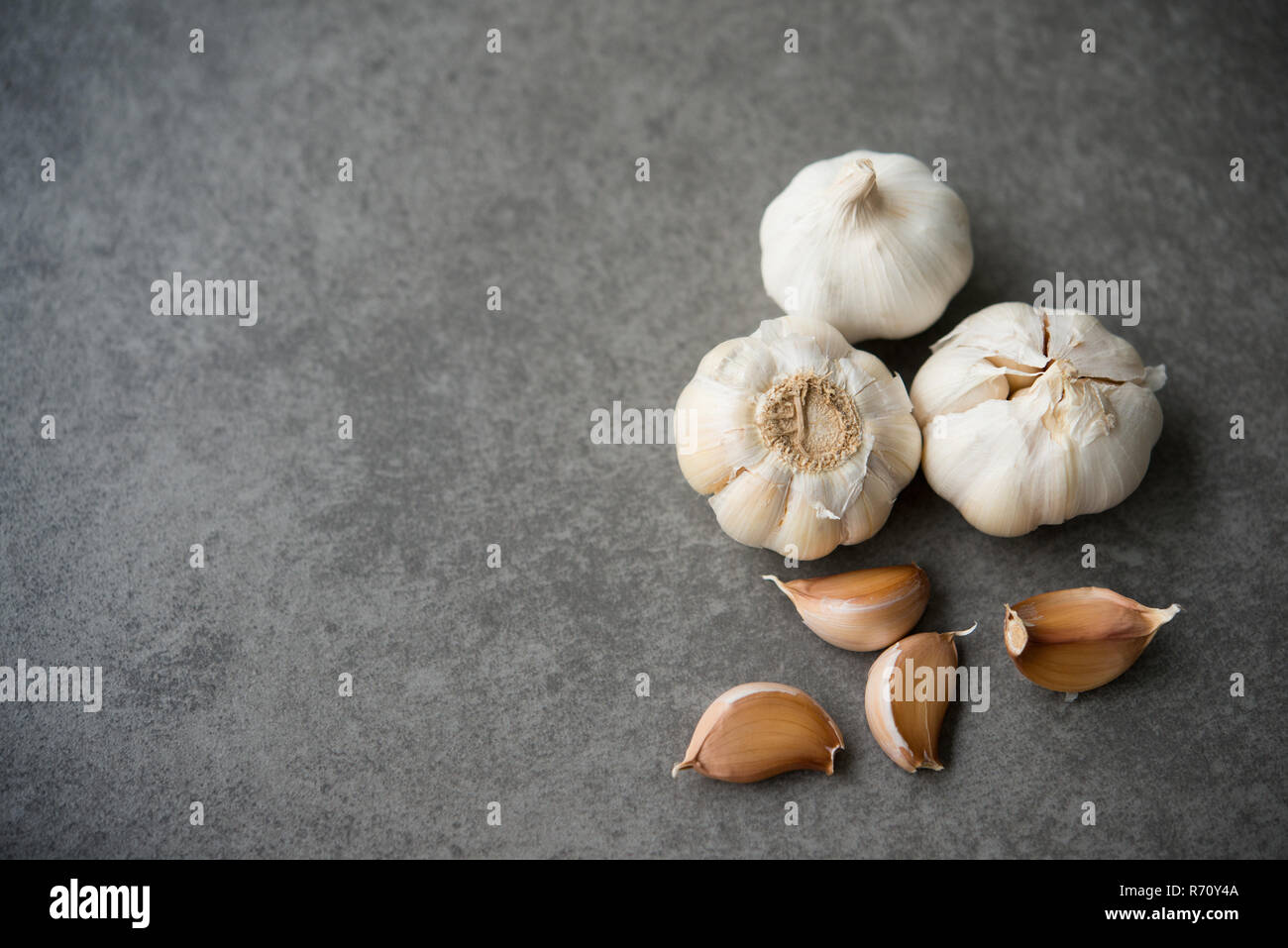 Top view garlic cloves and bulb with copy space on dark background ...