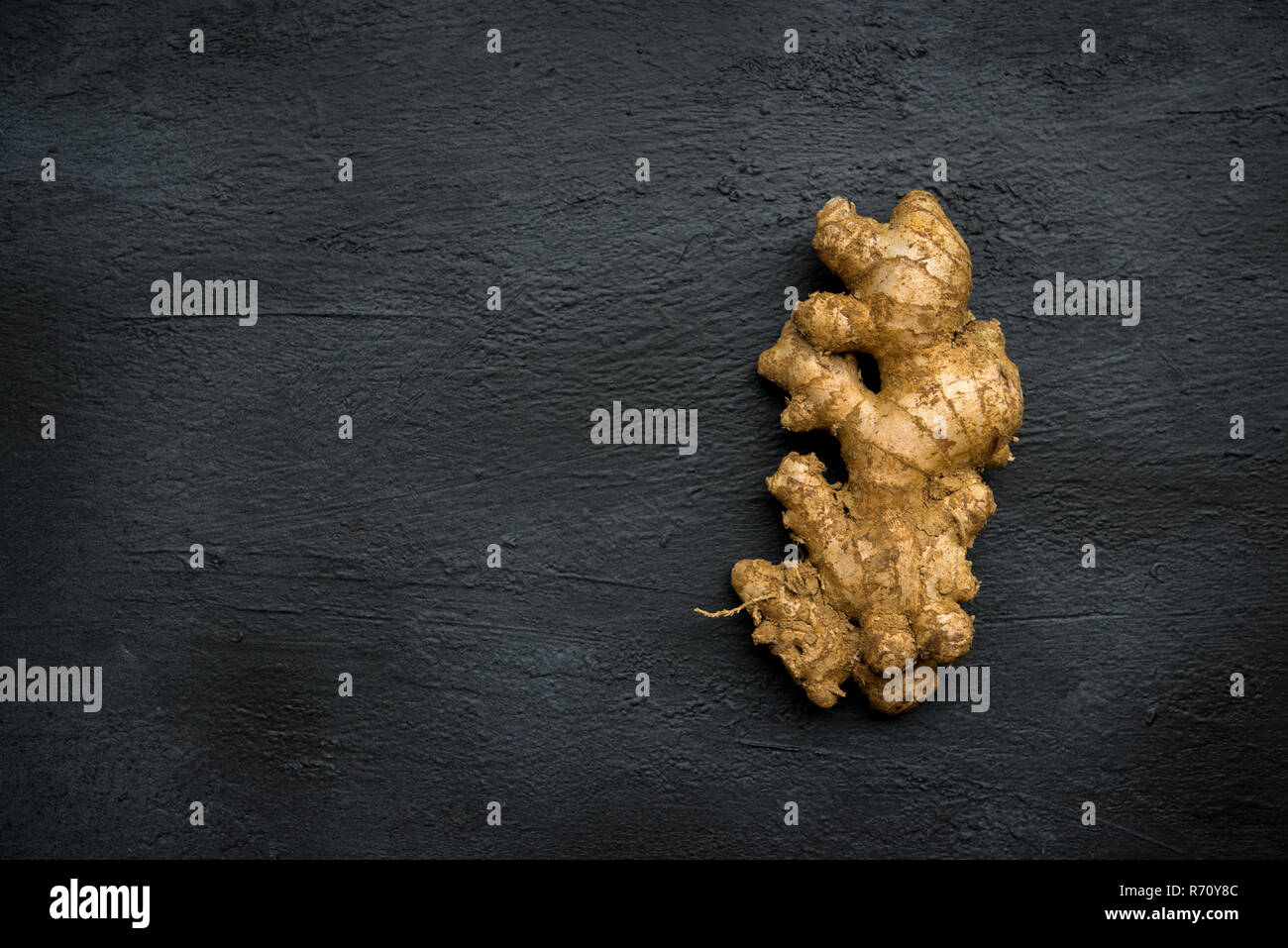 Top view fresh raw ginger root with copy space on dark background Stock ...