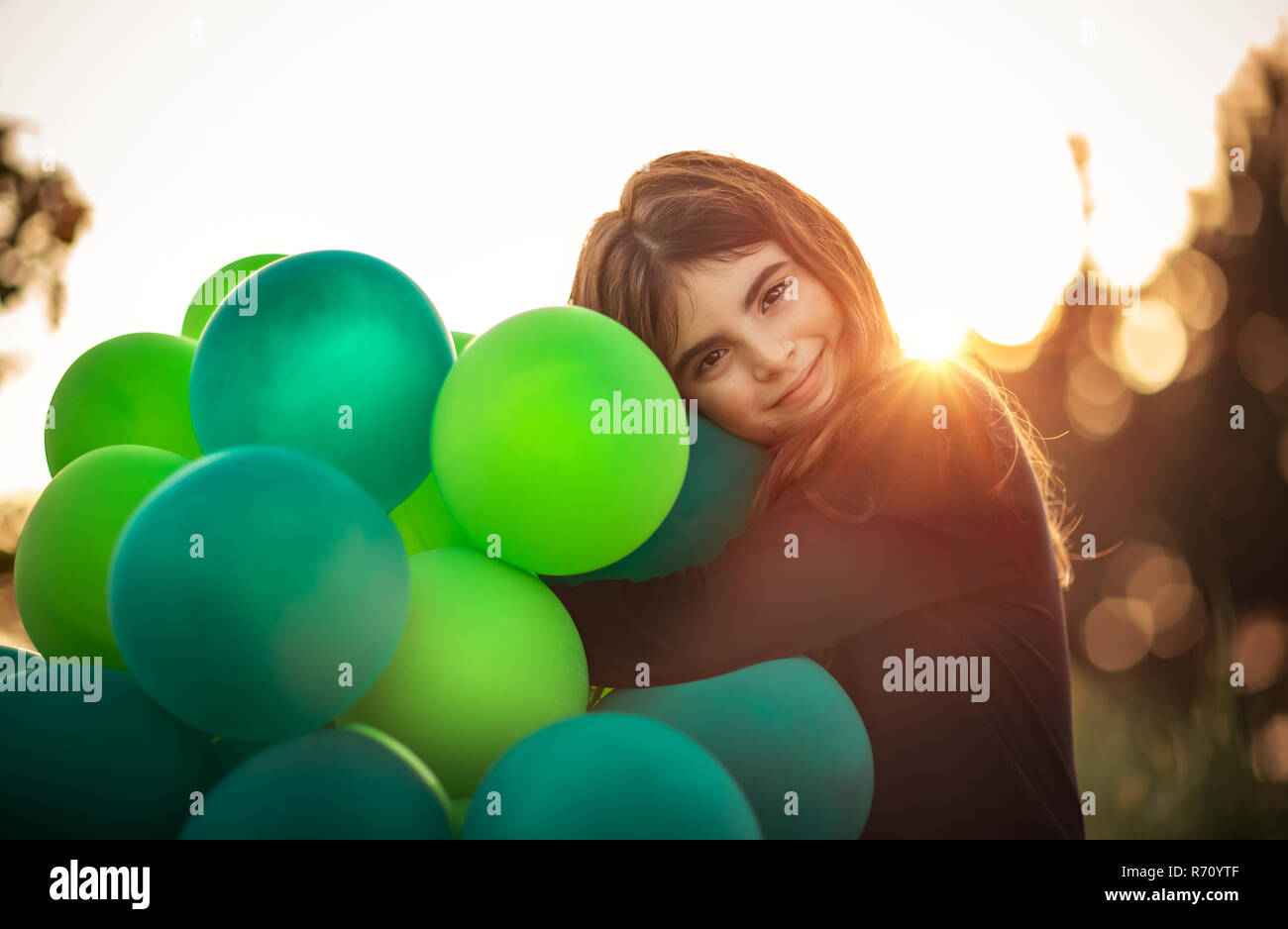 Cute girl with air balloons Stock Photo - Alamy