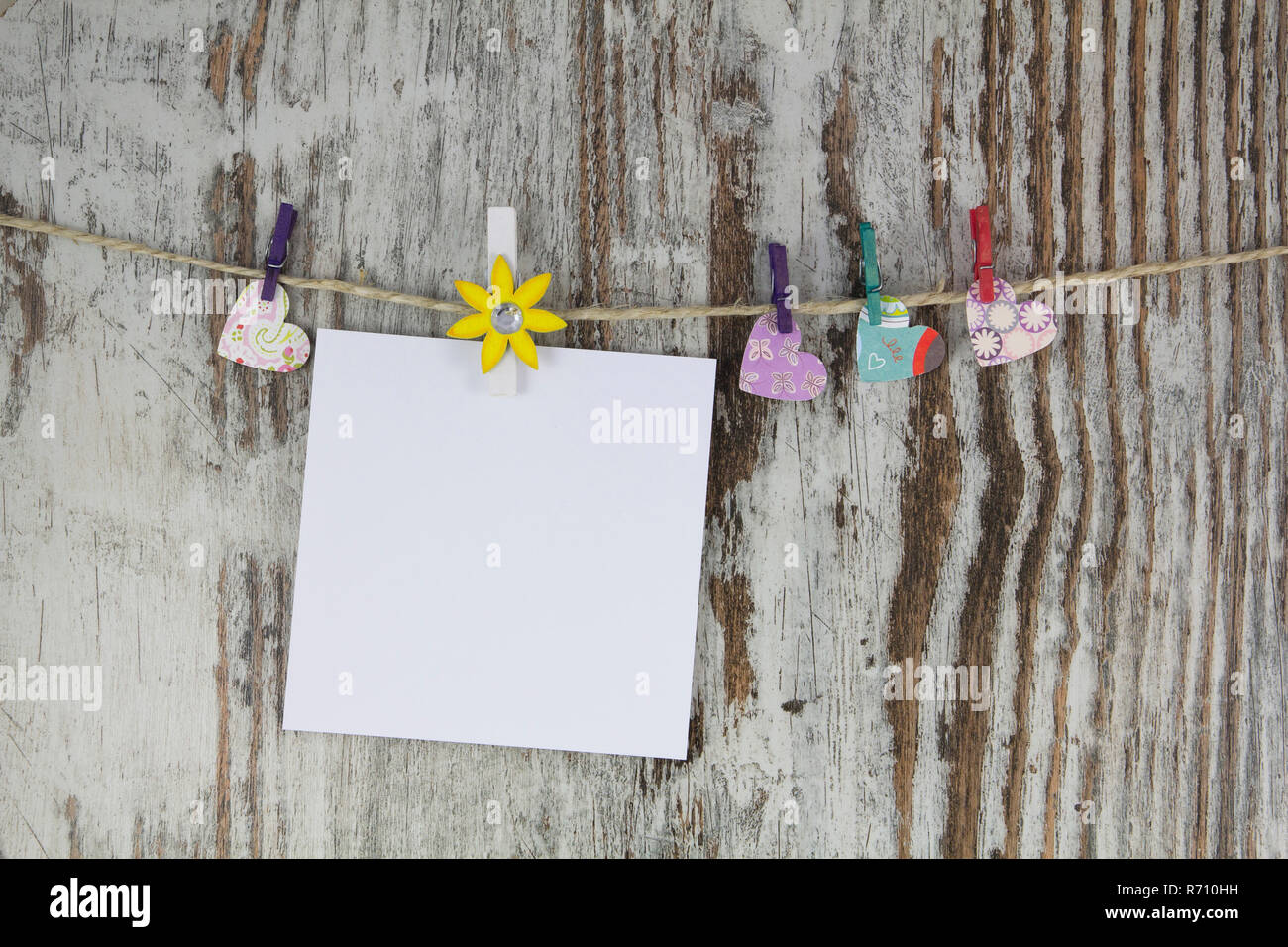 Empty note hanging with a clothespin, in a wood background Stock Photo ...