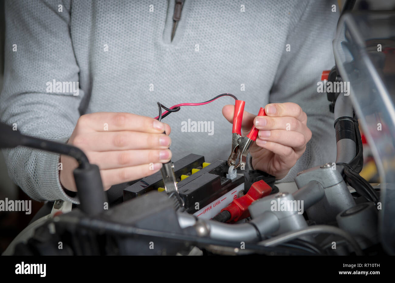charging the battery of motorcycle Stock Photo - Alamy