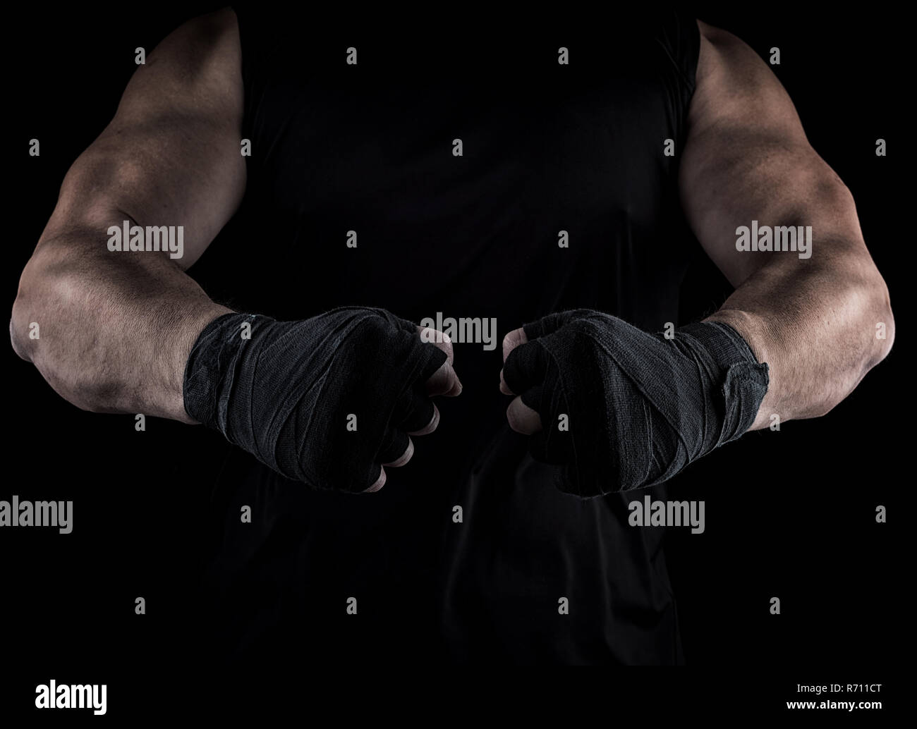 two men's hands wrapped in a black bandage, body parts in front of the ...