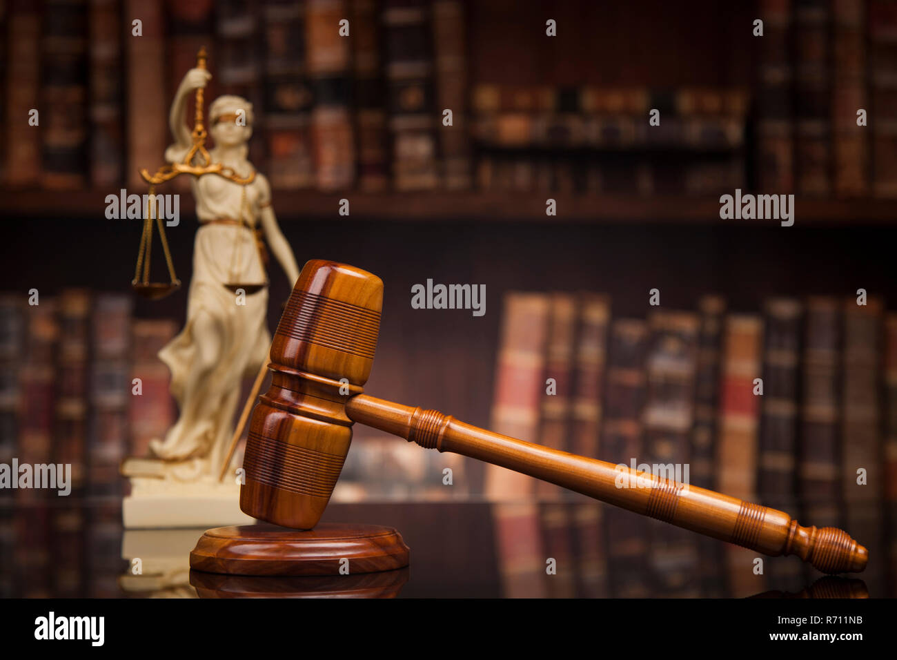Antique statue of justice, law, books background Stock Photo - Alamy