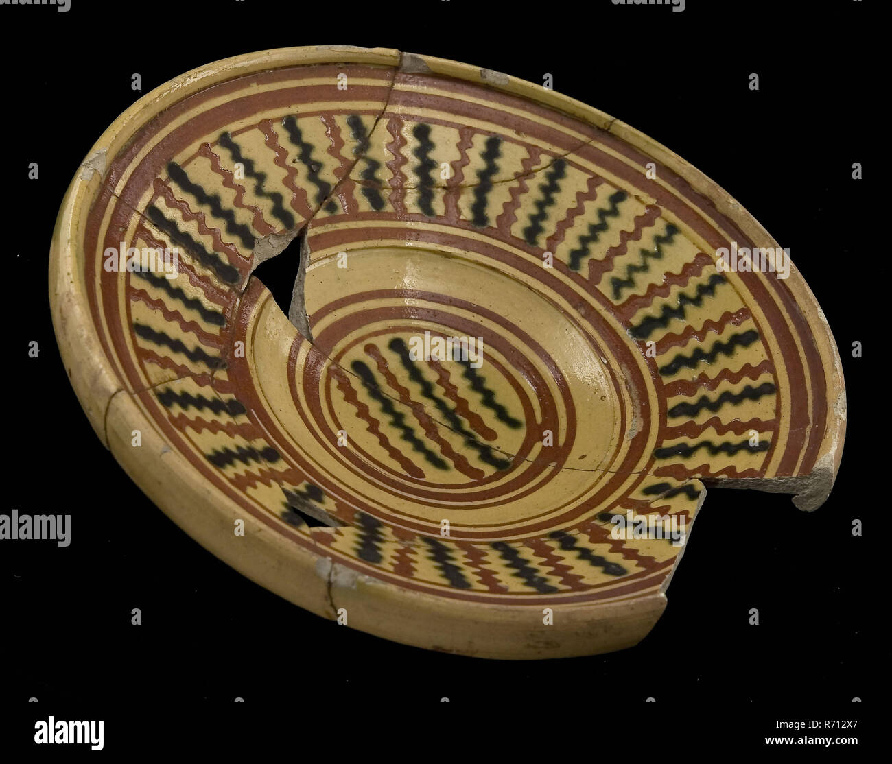 Earthenware dish on stand with red and green silt decoration, plate ...