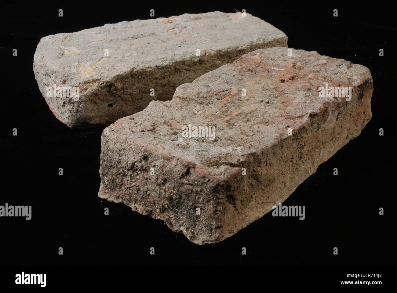 Two gray-red bricks from the tower or wall that were originally ...