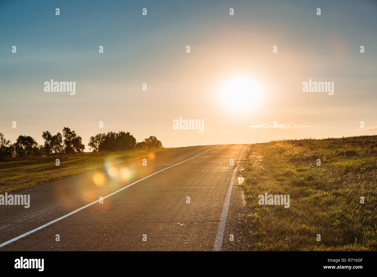 Sun Rising Above Asphalt Country Open Road In Sunny Morning Or Evening ...