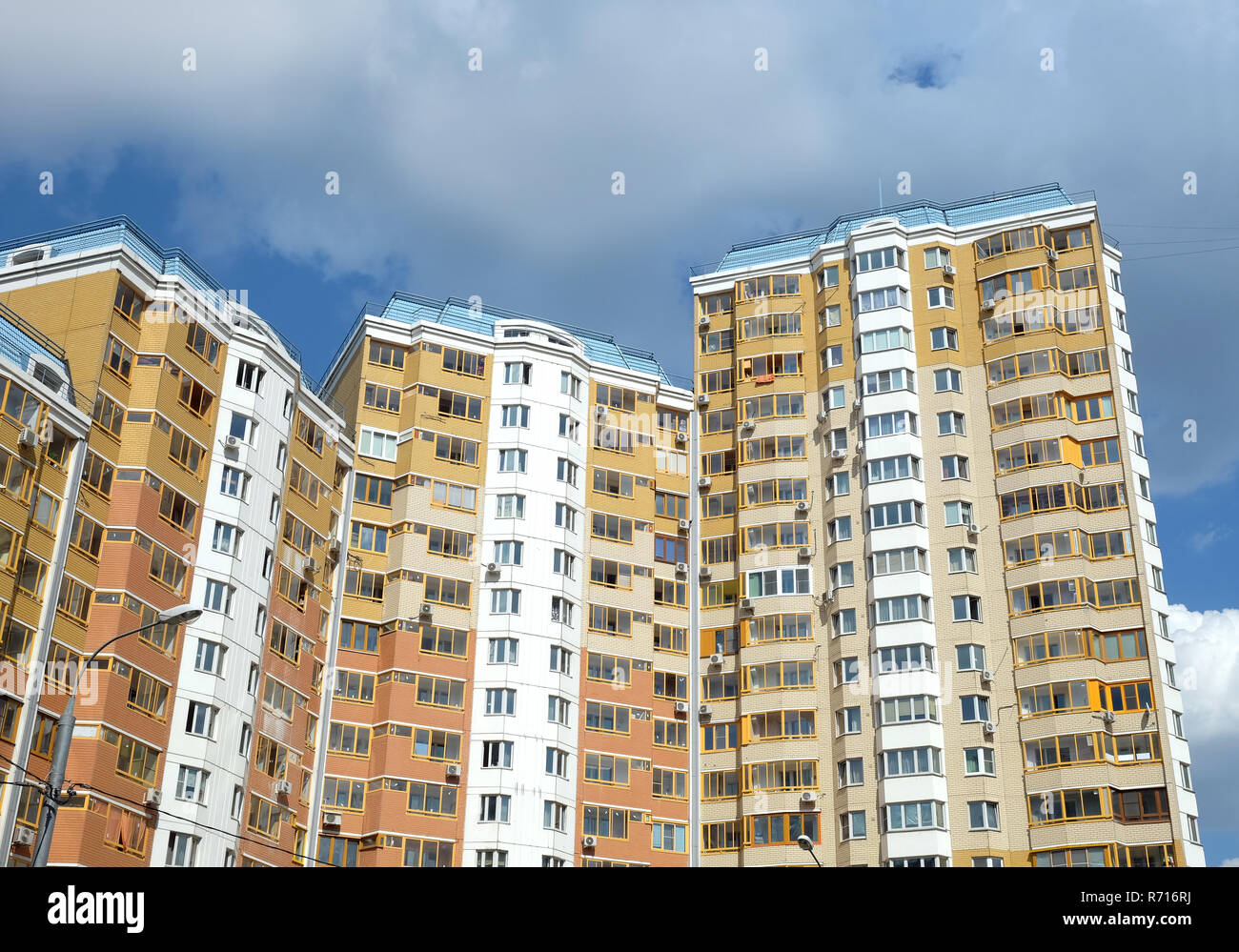 Top section of modern apartment buildings constructed from bricks over ...