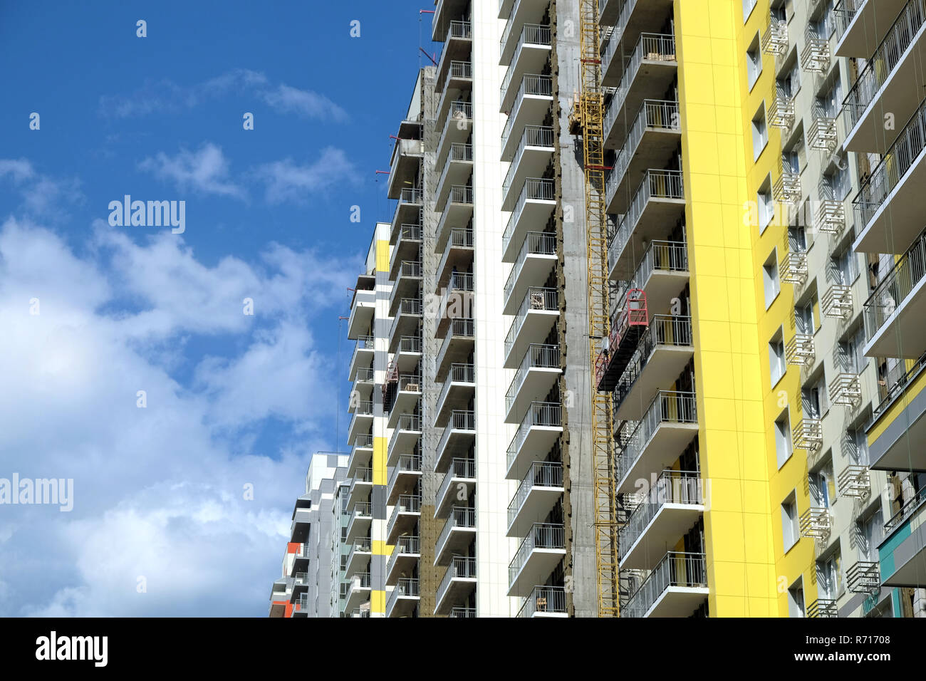 Facade of new colorful modern residential building side view on sunny ...