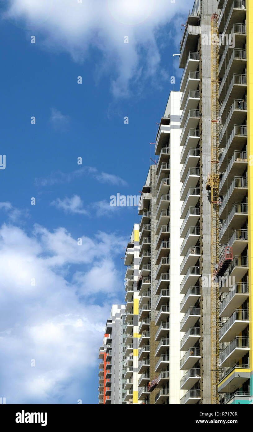 Facade of new colorful modern residential building side view on sunny ...