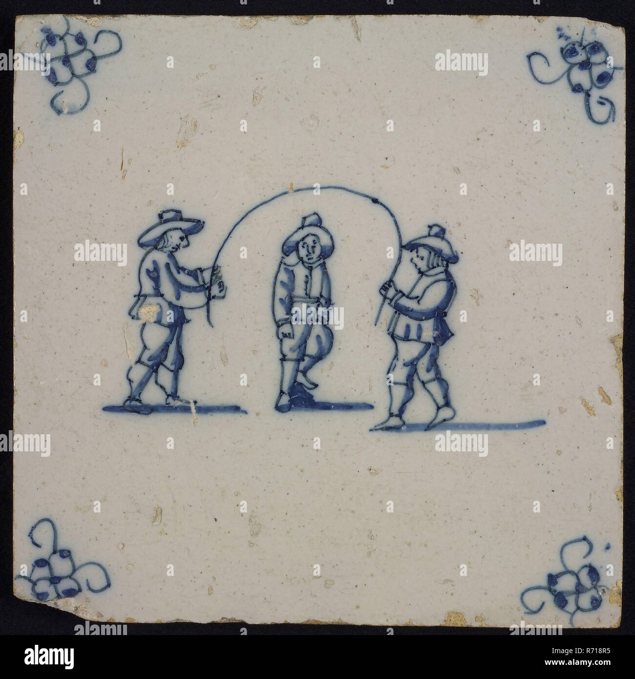 Scene tile, child's play, three boys, jumping rope, corner motif spider ...