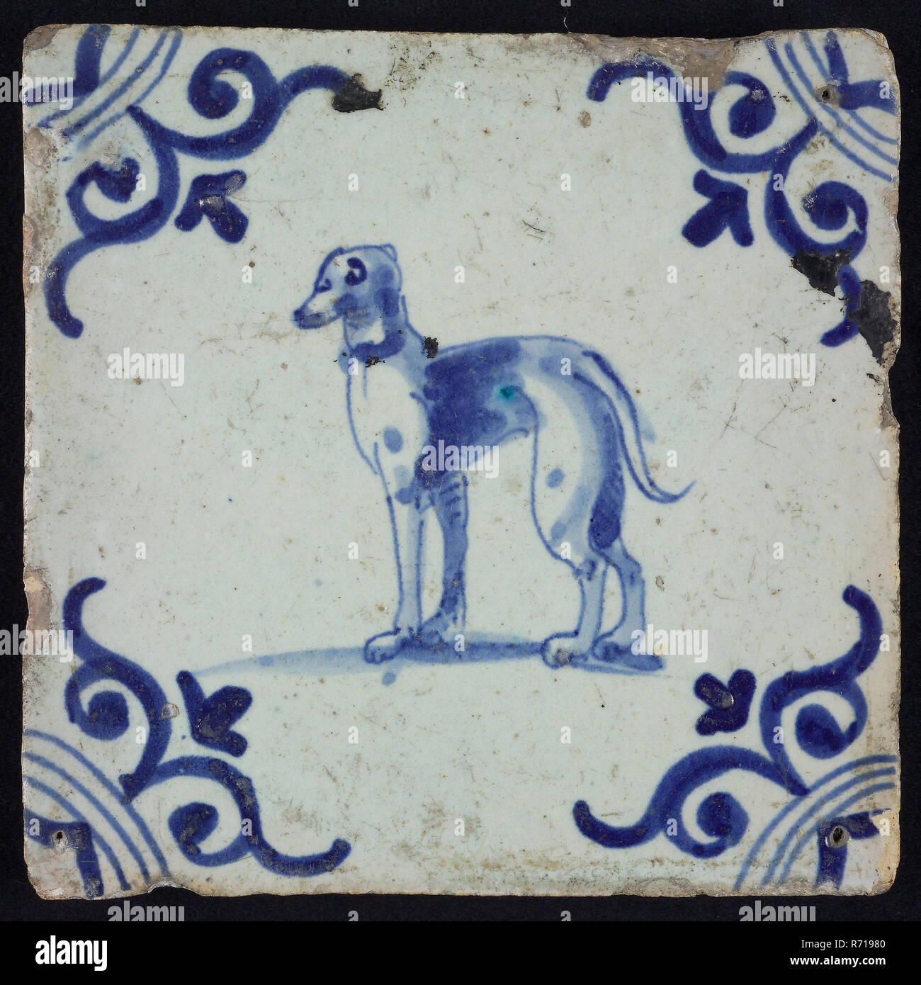 Animal tile, dog left on ground, in blue on white, corner motif large ...