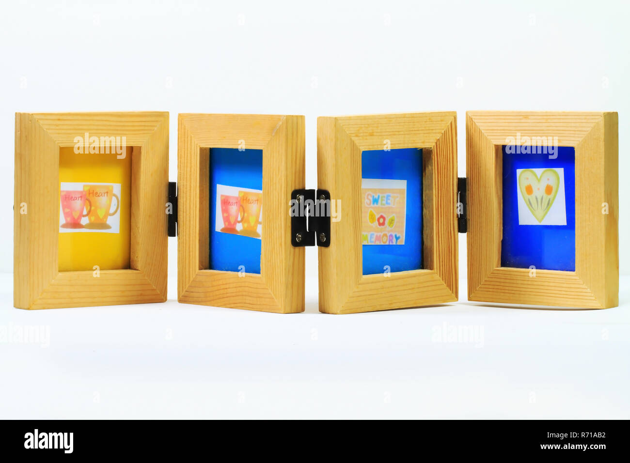 Wooden photo frame for 4 pictures Stock Photo - Alamy