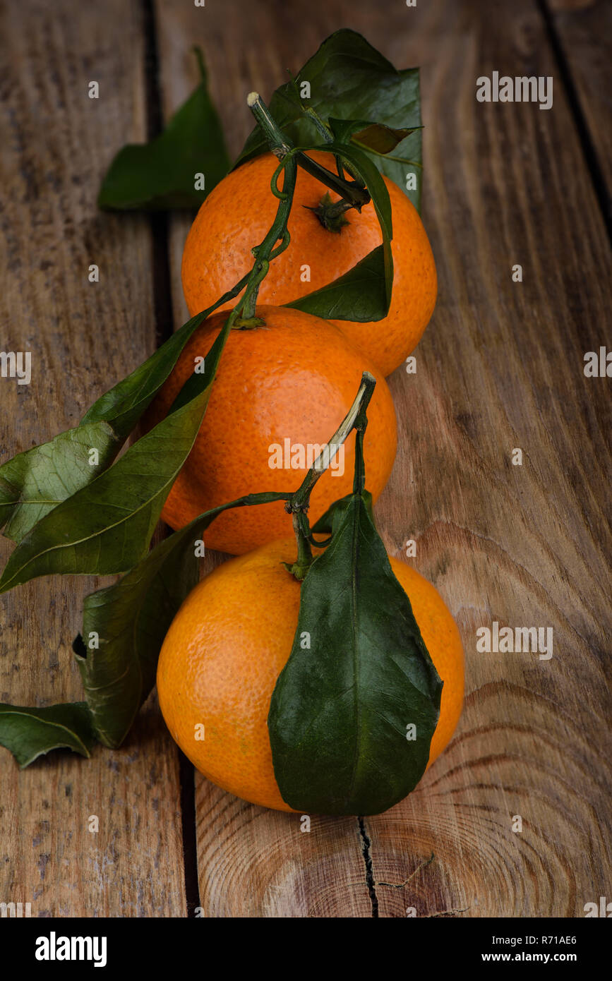 Three tangerines with leaves hi-res stock photography and images - Alamy
