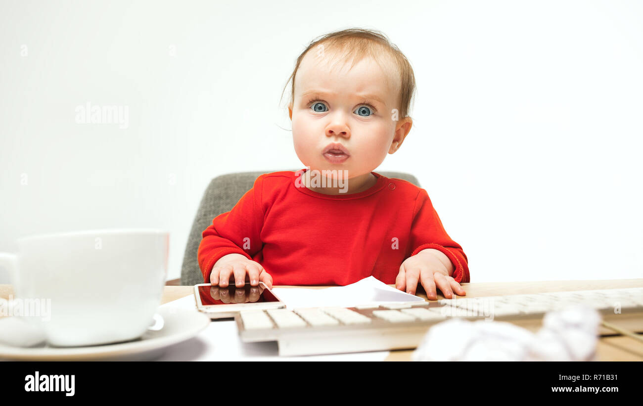 Happy child baby girl toddler sitting with keyboard of computer ...