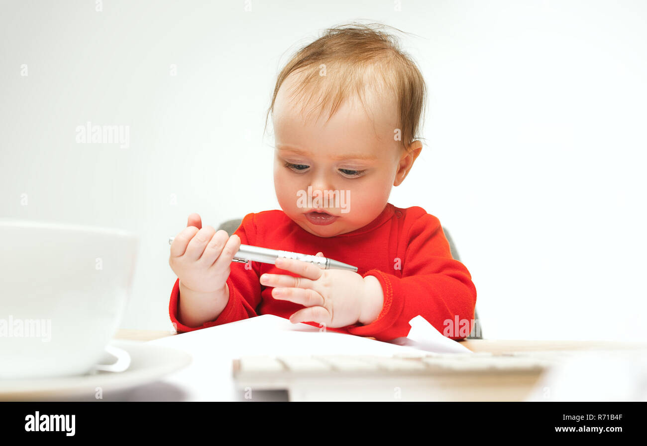 Happy child baby girl toddler sitting with keyboard of computer ...