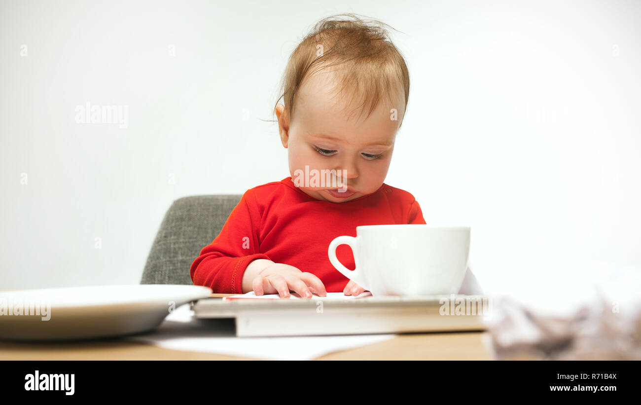 Happy child baby girl toddler sitting with keyboard of computer ...