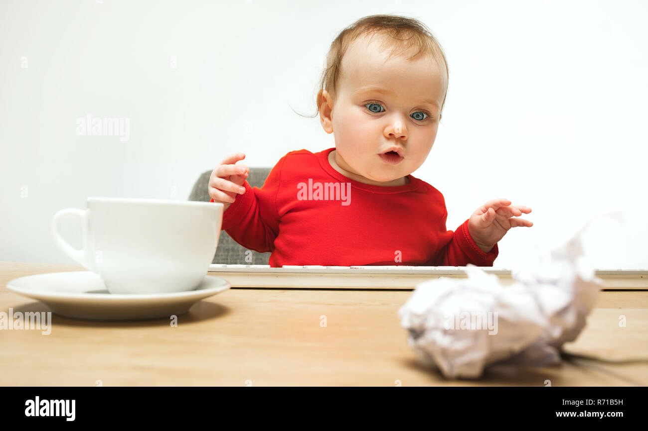Happy child baby girl toddler sitting with keyboard of computer ...