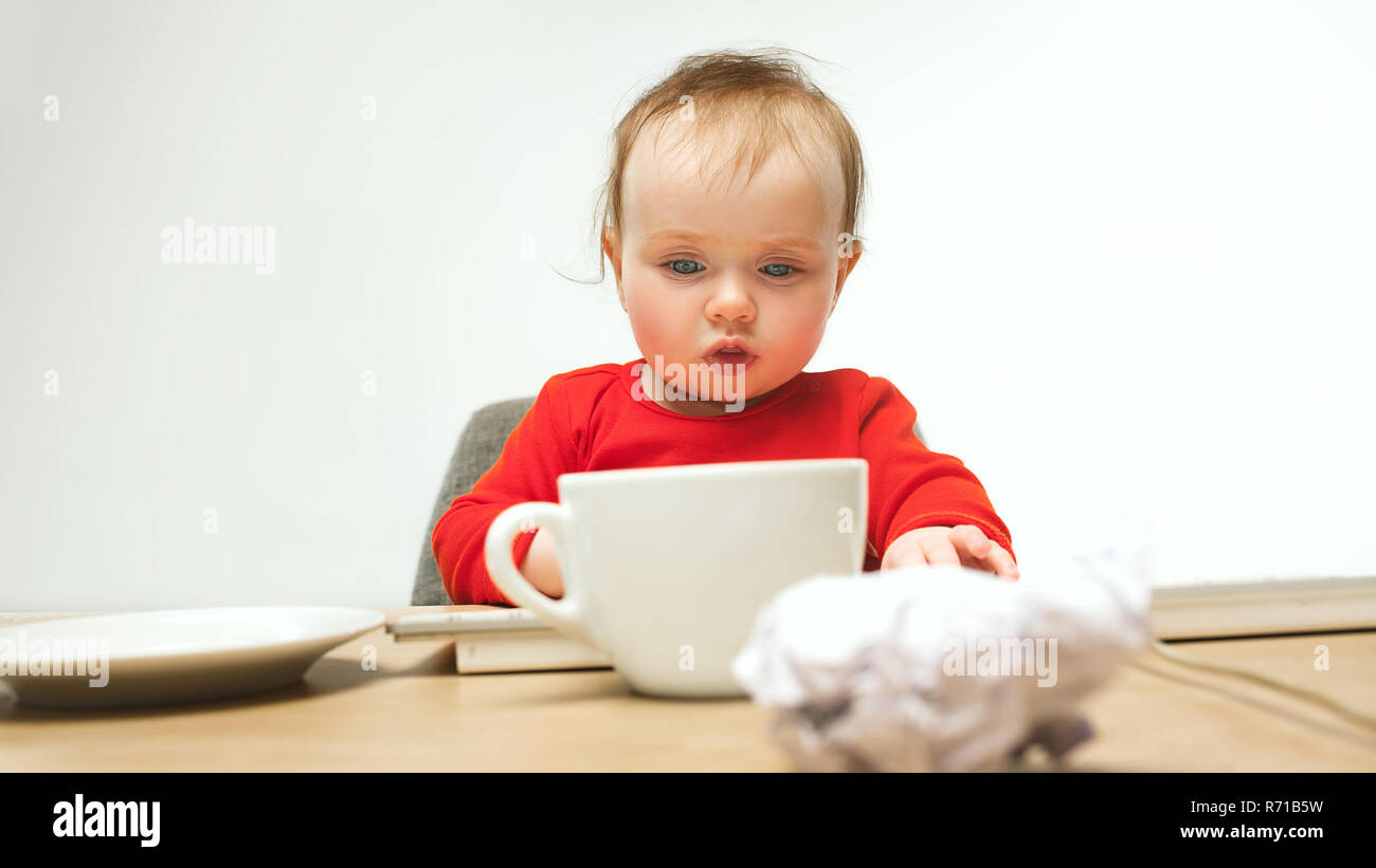 Happy child baby girl toddler sitting with keyboard of computer ...