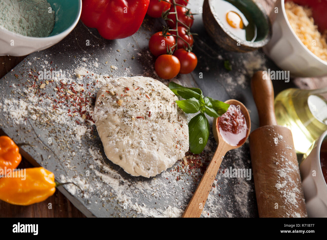 Homemade italian pizza preparation Stock Photo - Alamy