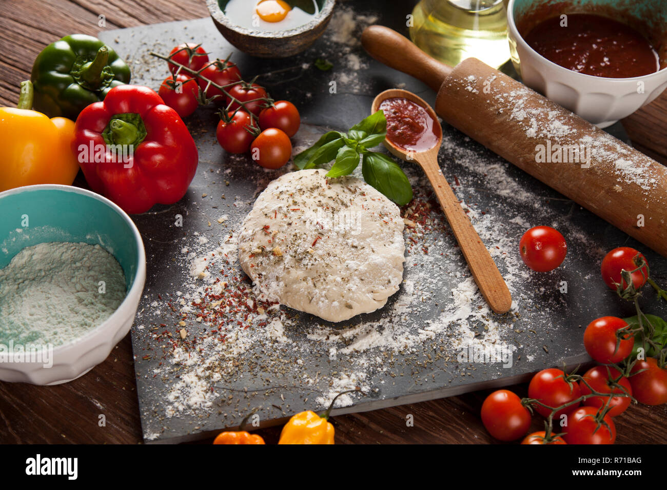 Homemade italian pizza preparation Stock Photo - Alamy