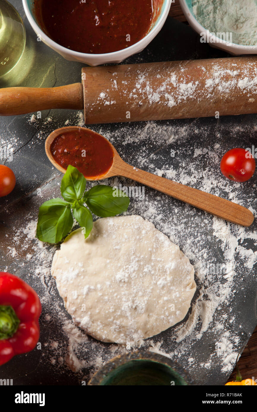 Homemade italian pizza preparation Stock Photo - Alamy