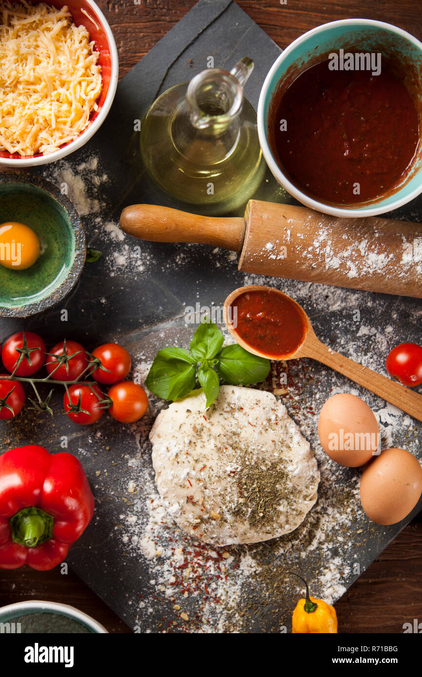 Homemade italian pizza preparation Stock Photo - Alamy