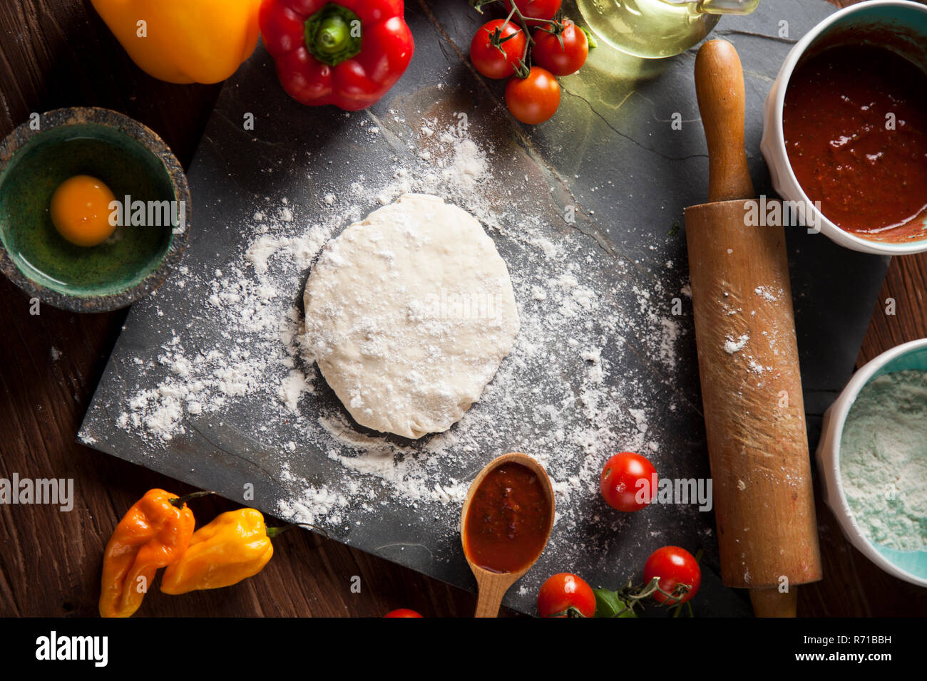 Homemade italian pizza preparation Stock Photo - Alamy