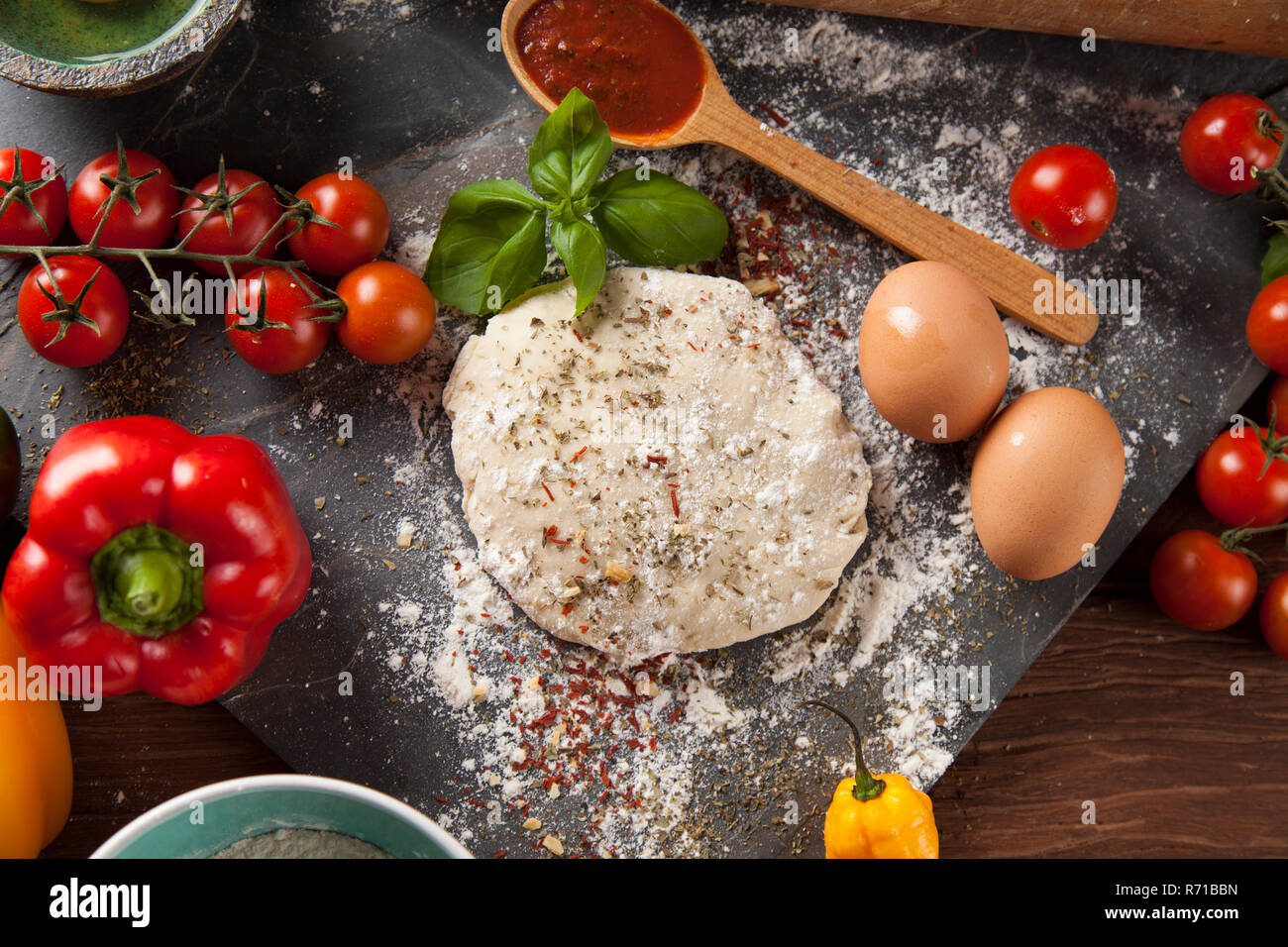 Homemade italian pizza preparation Stock Photo - Alamy