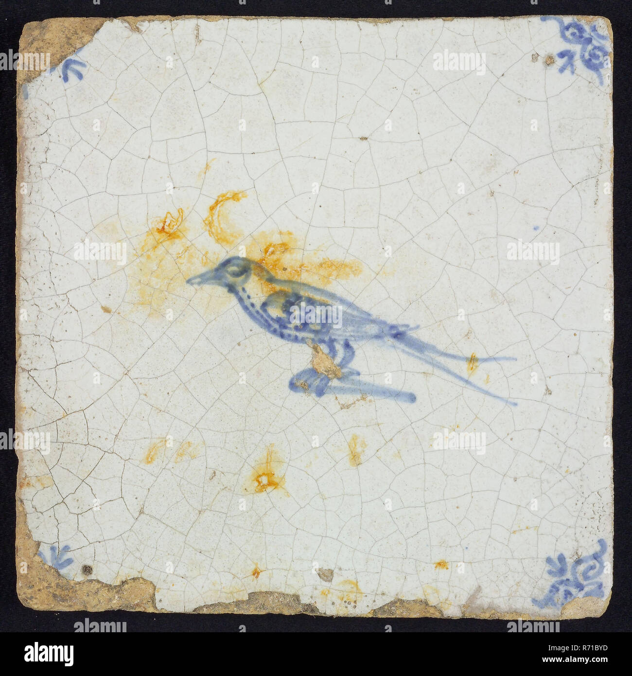 Animal tile, bird on ground to the left, in blue on white, corner motif ...