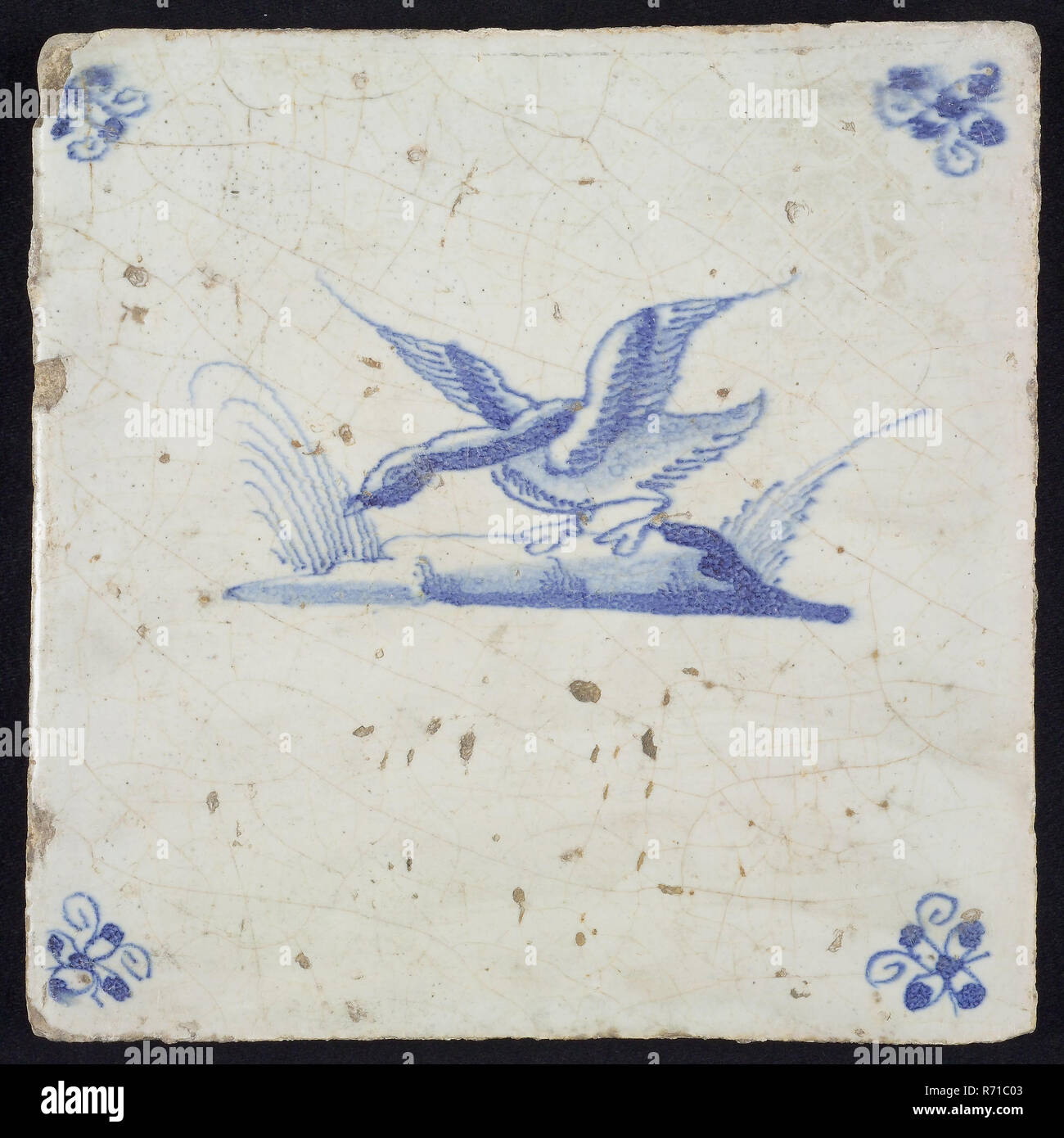 Animal tile, flying bird to the left above water, in the background ...