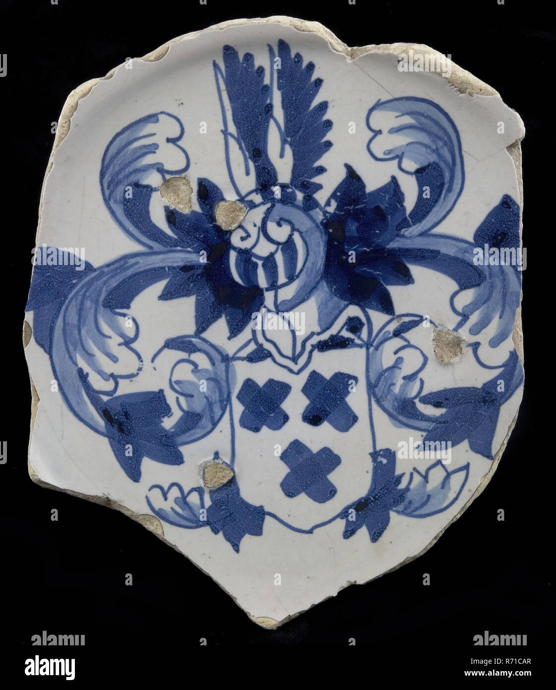 Fragment majolica dish, blue on white, heraldic image, helmeted coat of ...
