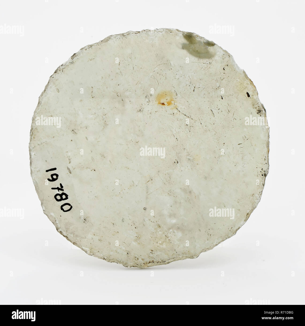 Raw round glass disk of thin, green window glass, window glass building ...