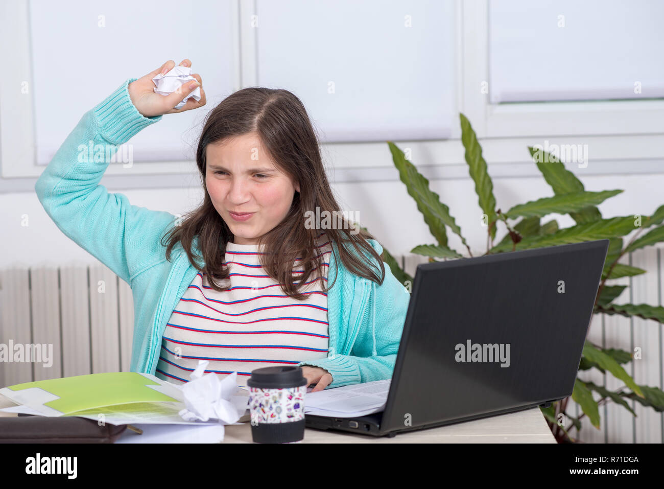 angry girl doing her homework Stock Photo - Alamy