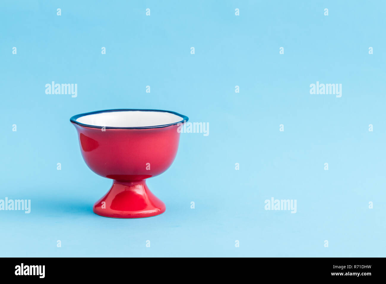 Red Porcelain Ice Cream Bowl with Enamel Look Stock Photo - Alamy