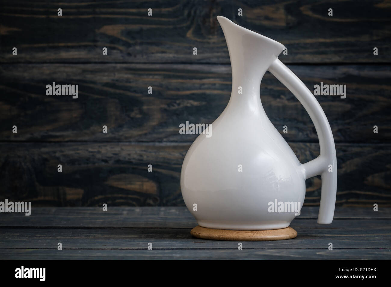Decorative White Ceramic Jug on Blue Background Stock Photo - Alamy