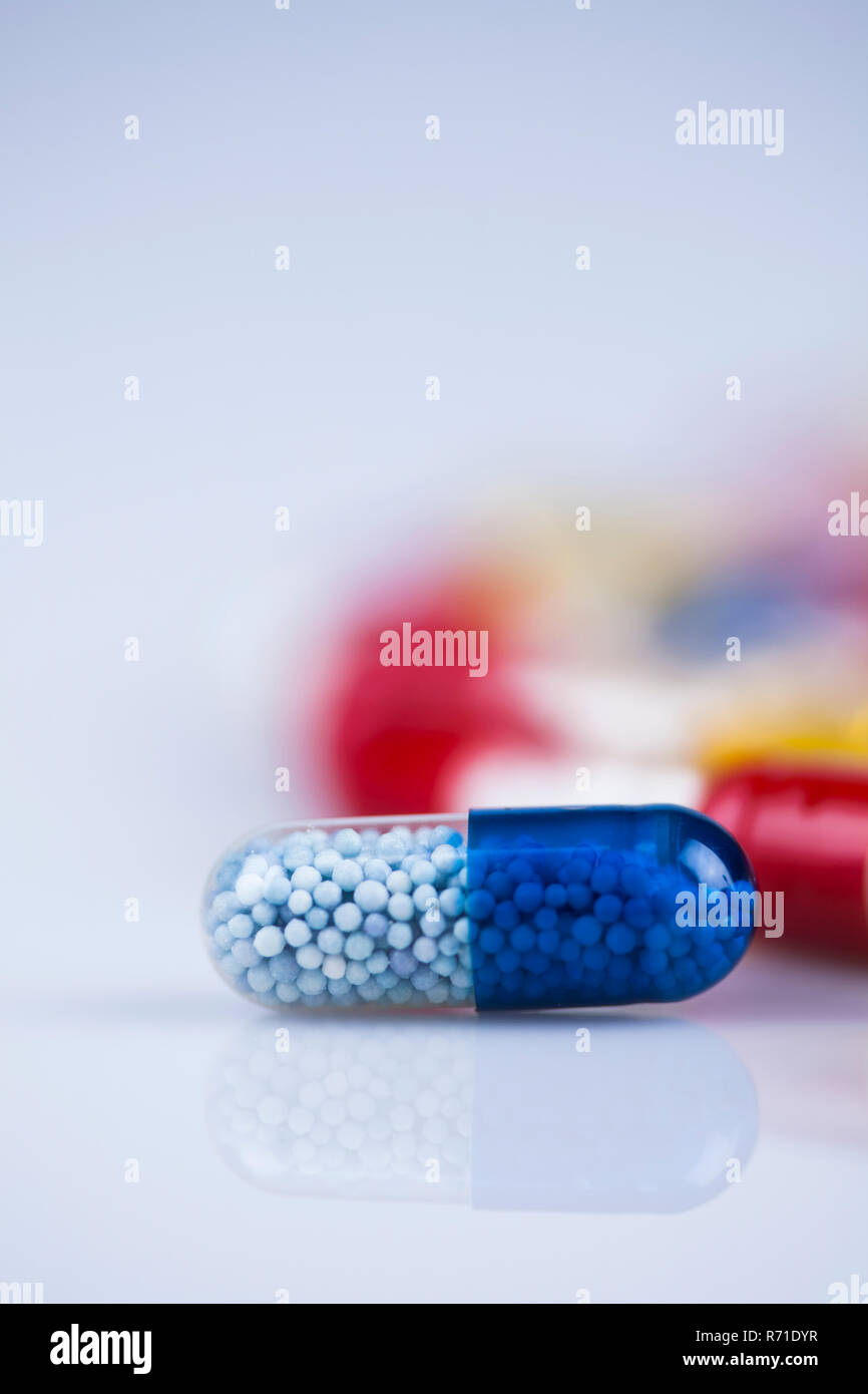 Composition with variety of drug pills background Stock Photo - Alamy