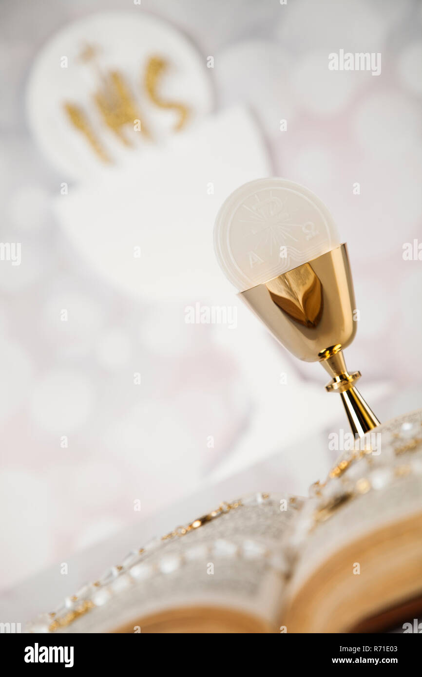 Holy communion a golden chalice with grapes and bread wafers Stock ...
