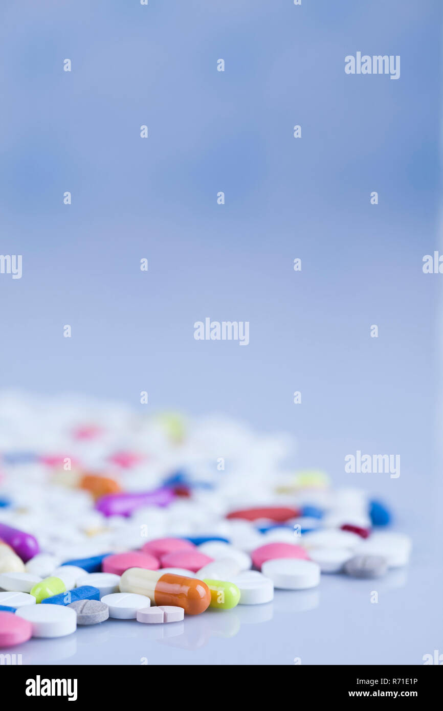 Composition with variety of drug pills background Stock Photo - Alamy
